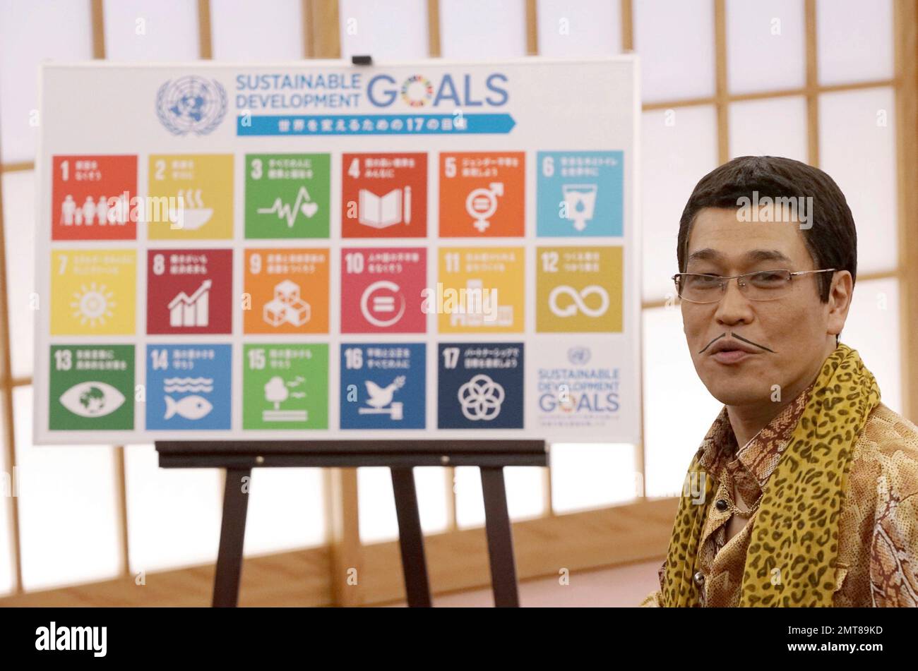 Japanese comedian Pikotaro talks with Japanese Foreign Minister Fumio Kishida during a meeting ...