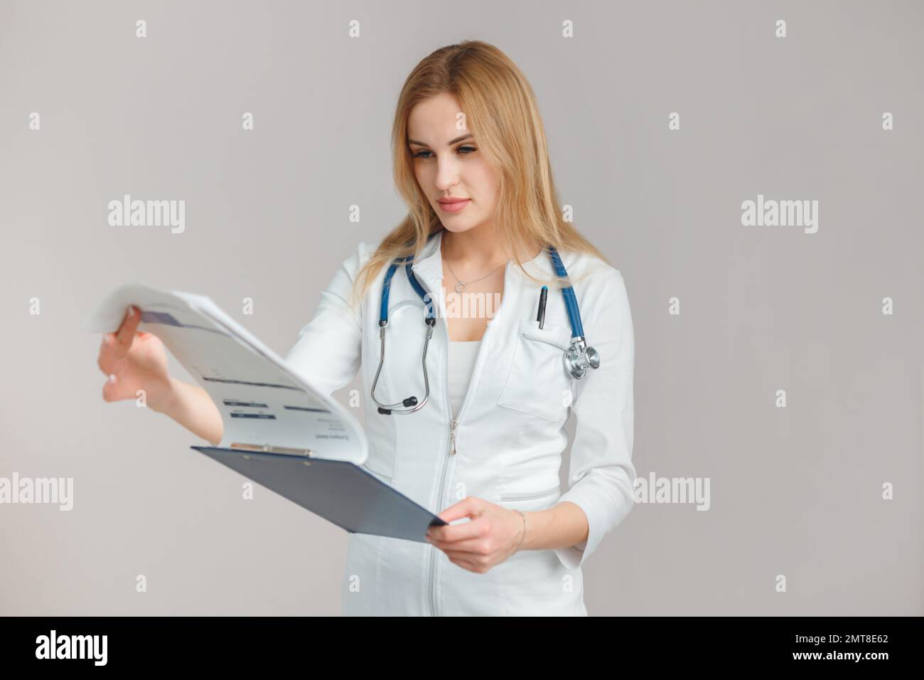 Young European Female Doctor Portrait with stethoscope and folder ...