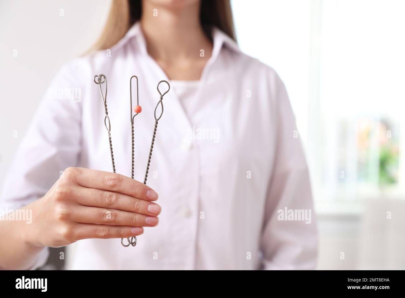 Speech therapist with logopedic probes in clinic, closeup. Space for ...