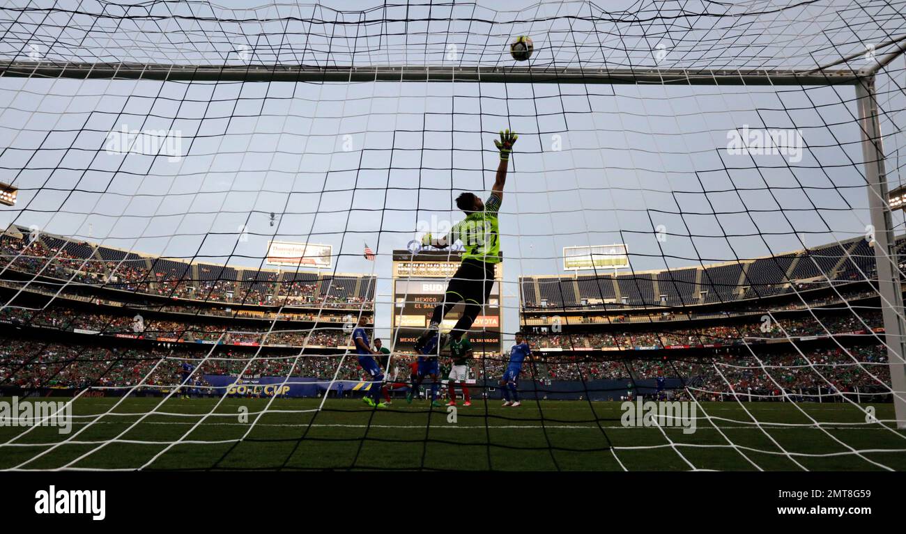 El Salvador goalkeeper Benji Villalobos leaps as a shot from Mexico ...