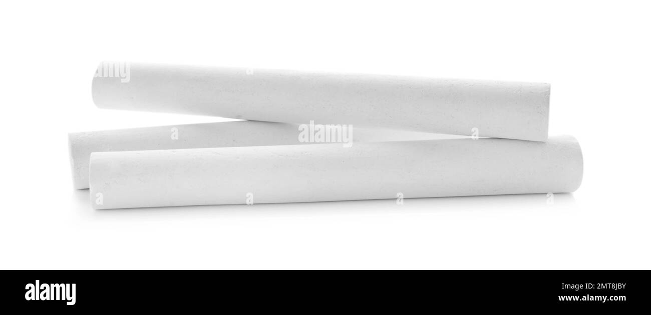 Small pieces of chalk on white background Stock Photo - Alamy