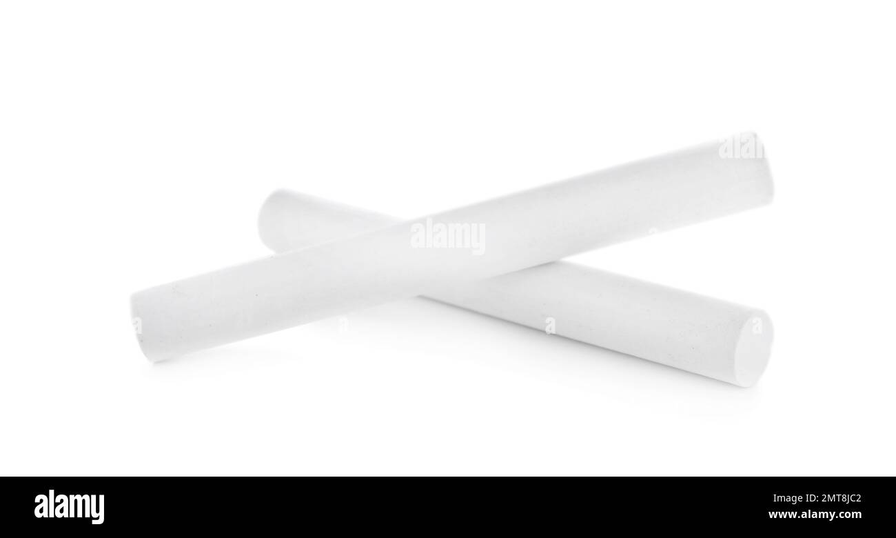Small pieces of chalk on white background Stock Photo - Alamy