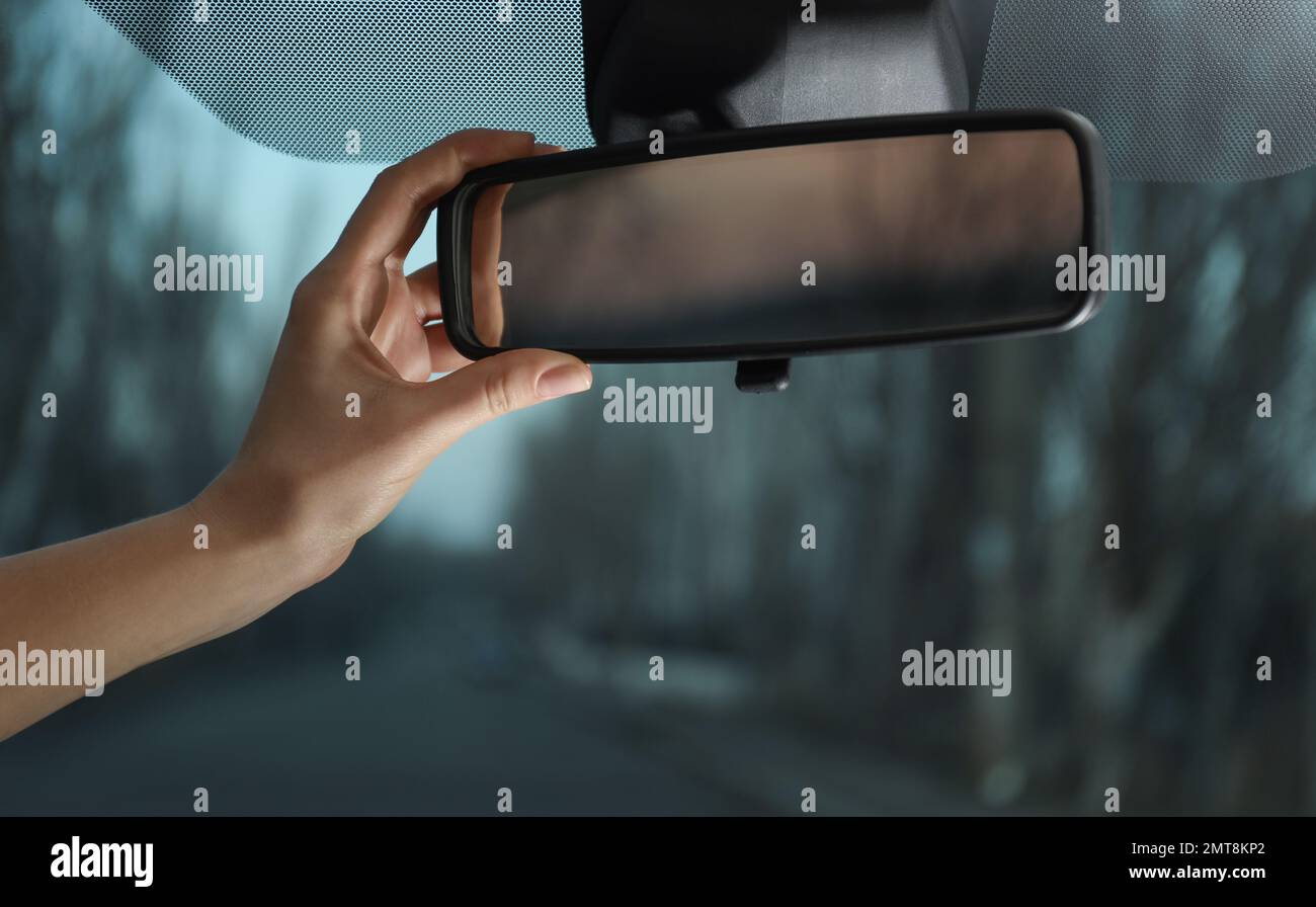 Hand adjusting mirror hi-res stock photography and images - Alamy