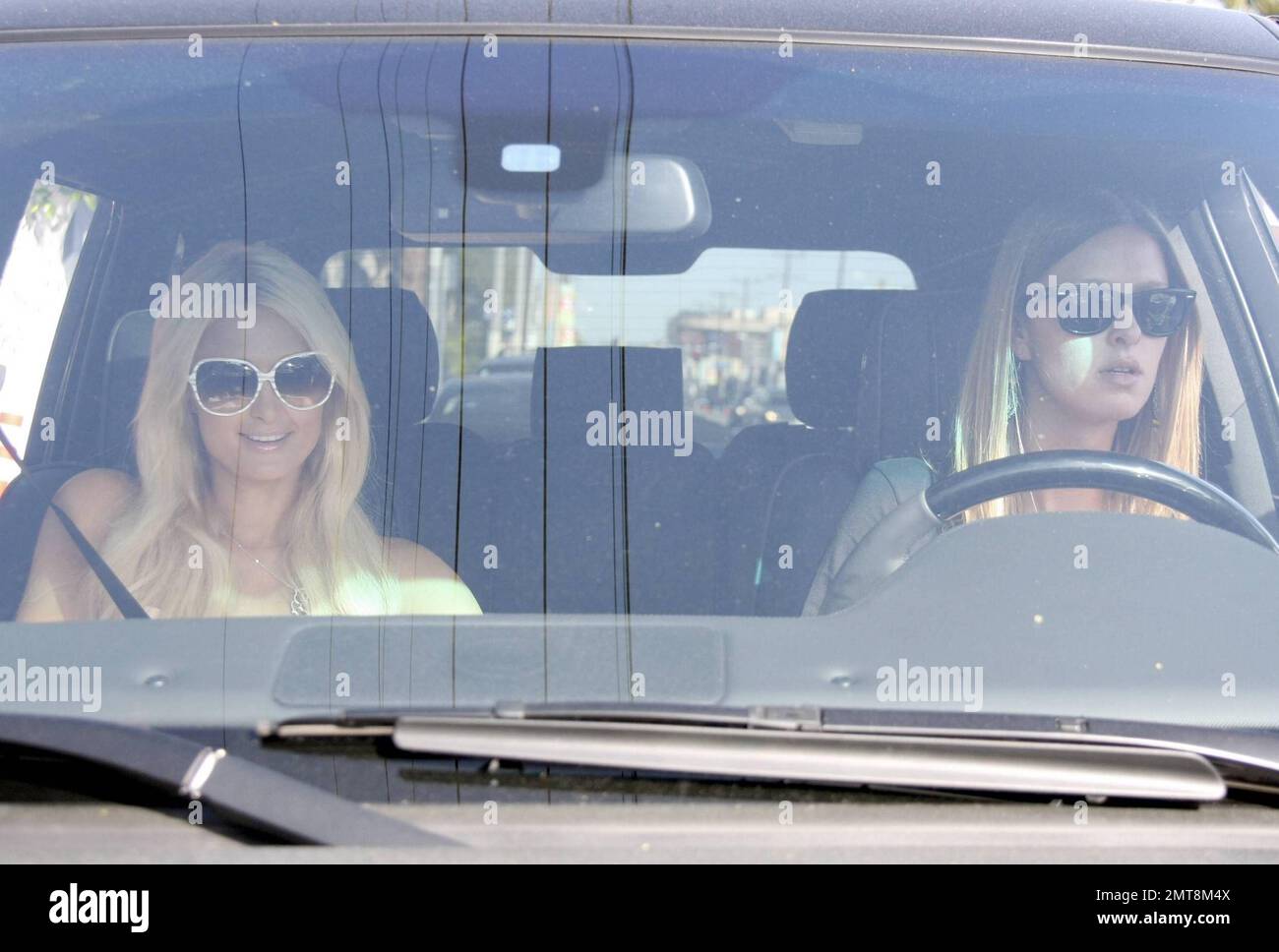 Paris and Nicky Hilton spend an afternoon out in West Hollywood. The two sisters dropped in at ...