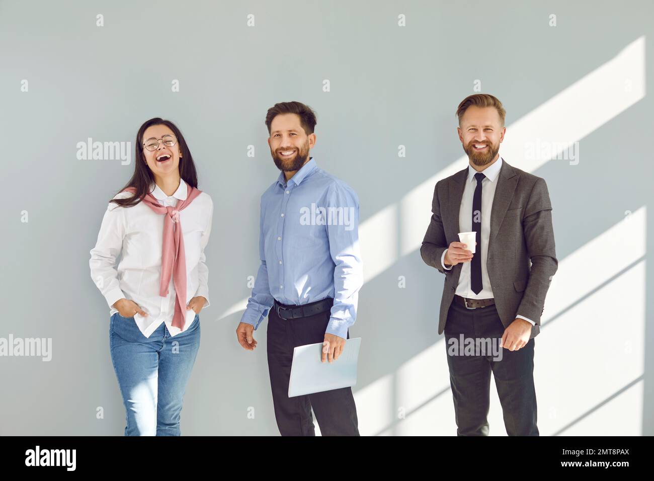 Happy cheerful positive business team having fun during a break at work ...