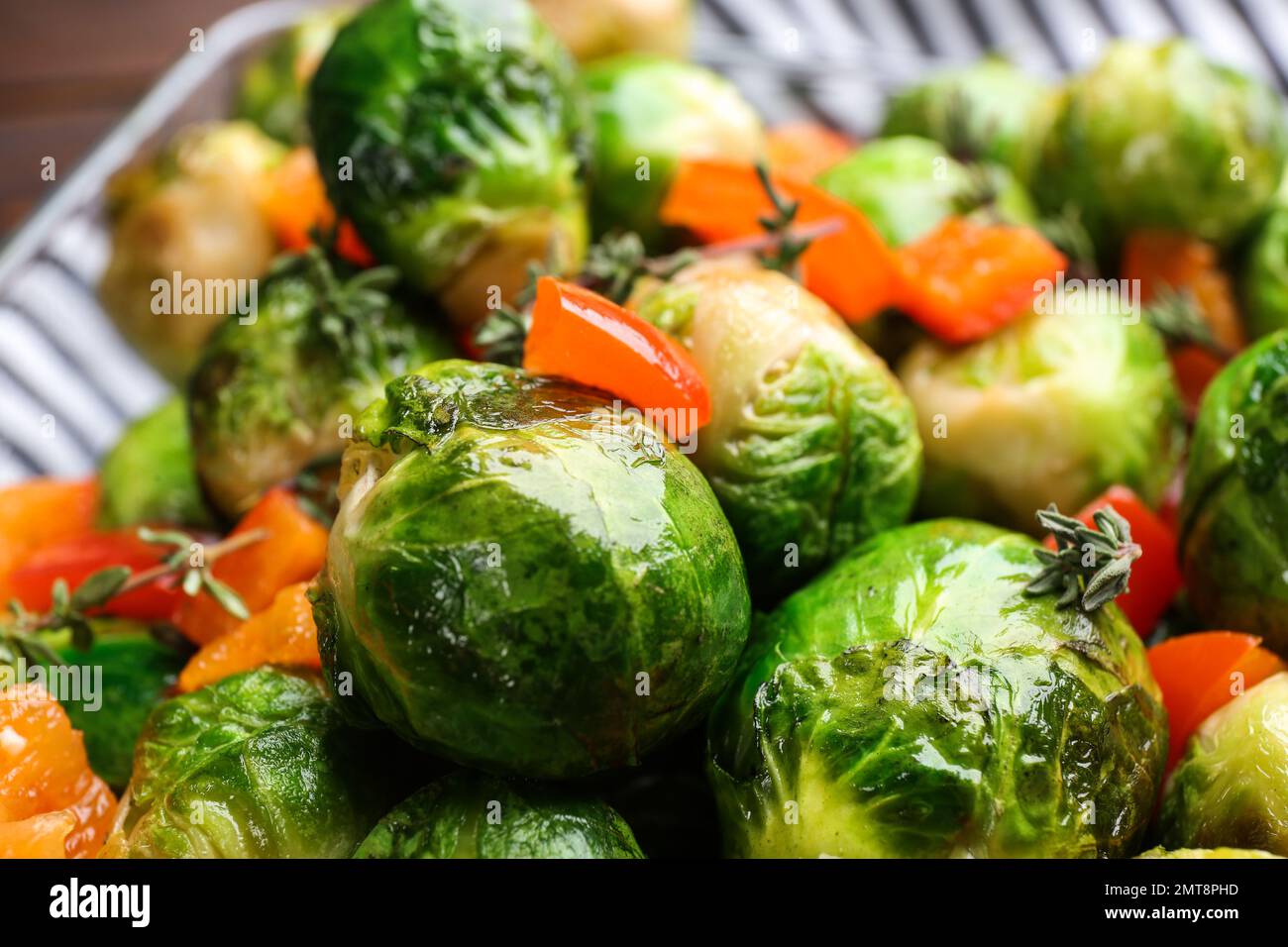 Delicious roasted Brussels sprouts with bell pepper as background ...