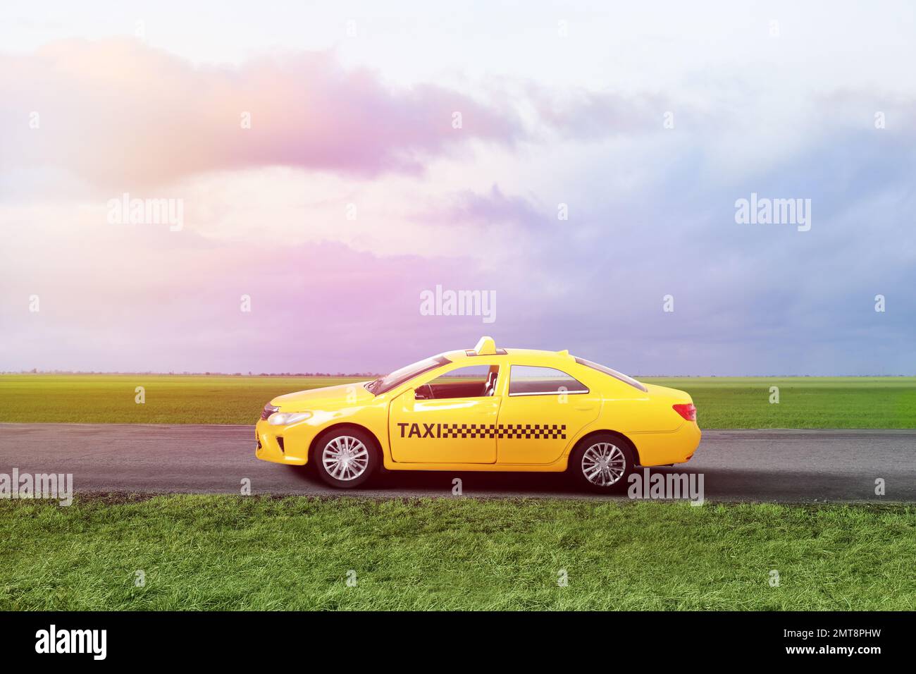 Yellow taxi car on asphalt highway outdoors Stock Photo - Alamy
