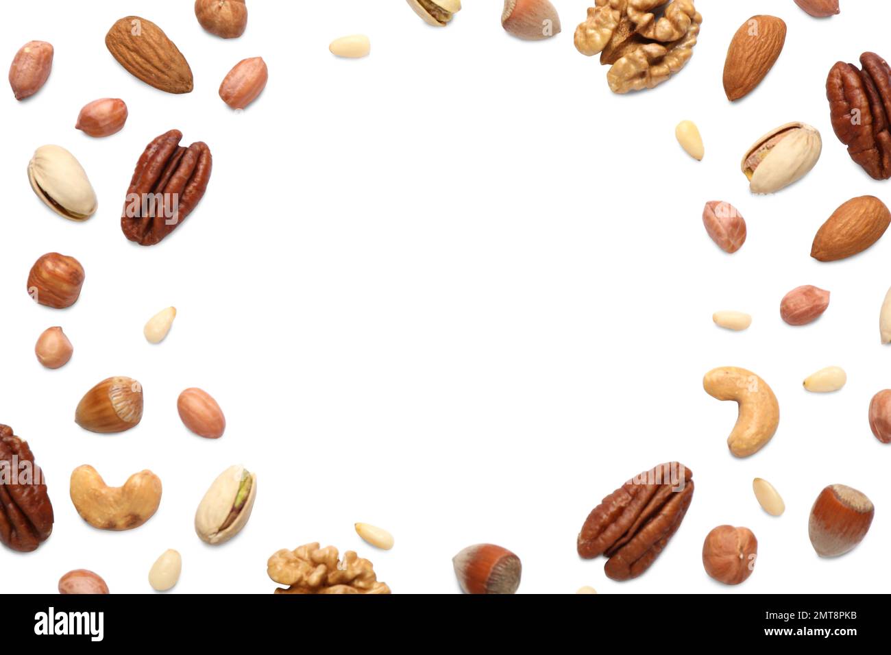 Different delicious nuts on white background, flat lay. Space for text ...