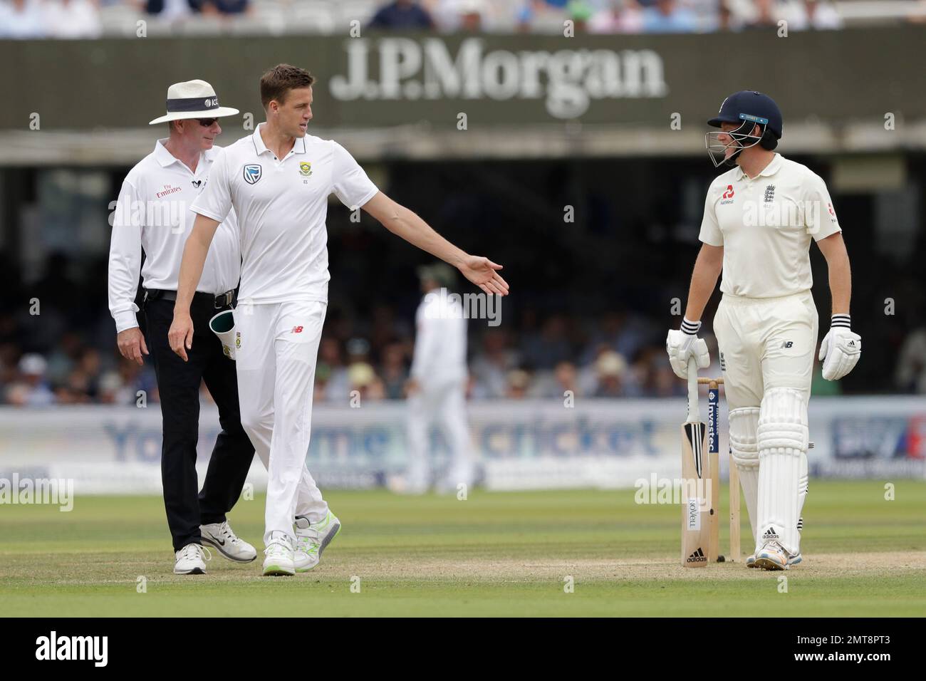 England wicketkeeper Jonny Bairstow, right, talks with South Africa's ...