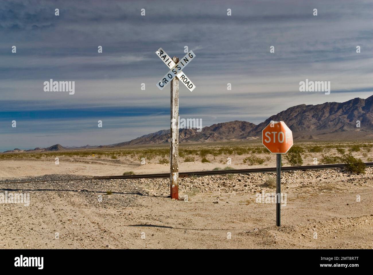 Railway crossing, Cadiz Road, Ship Mountains in distance, Mojave Desert ...