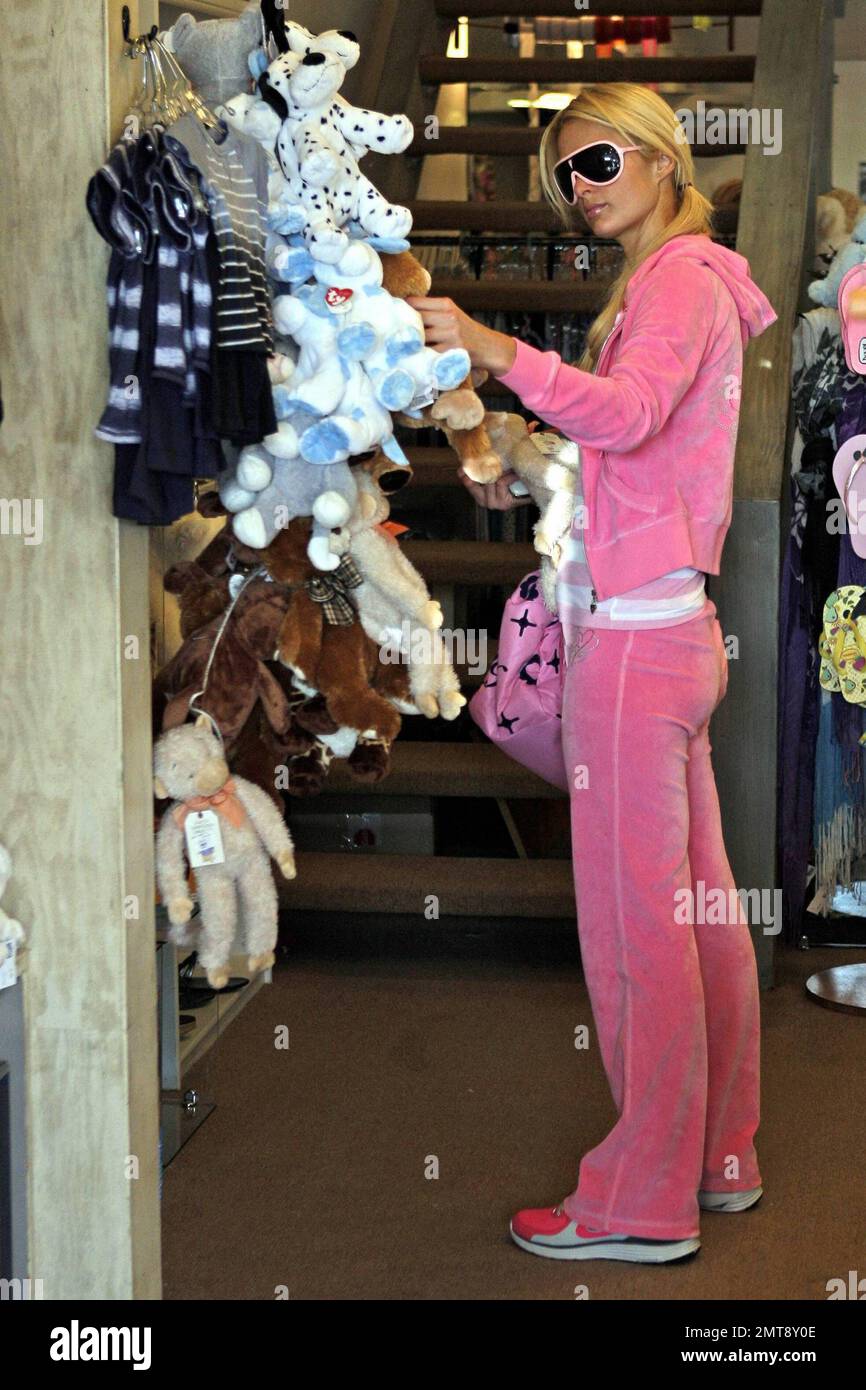 Paris Hilton starts her Easter shopping, buying a large yellow stuffed ...