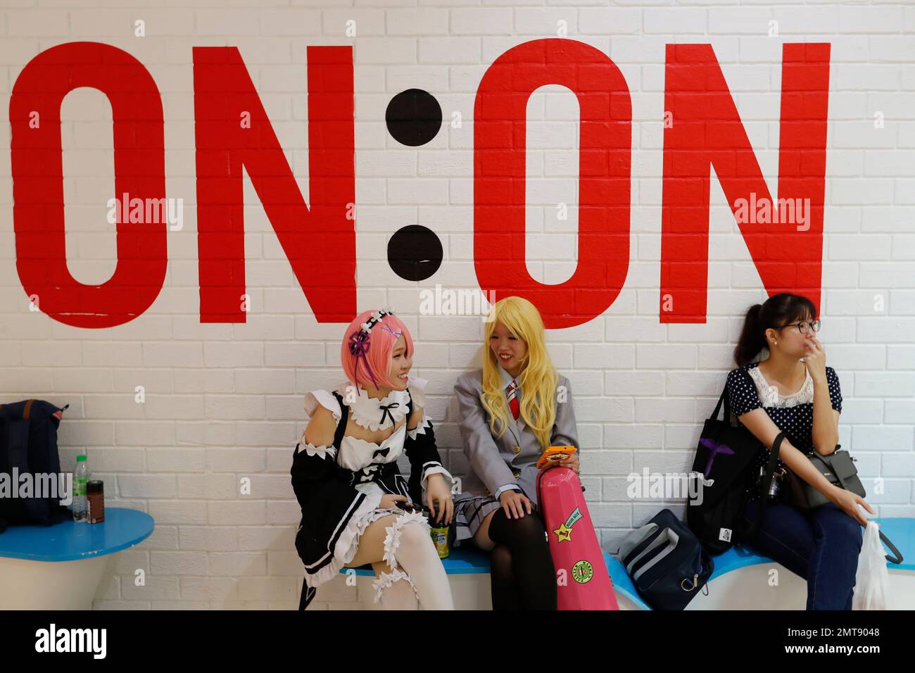 Cosplayers wait to take part in a cosplay event at a shopping mall ...