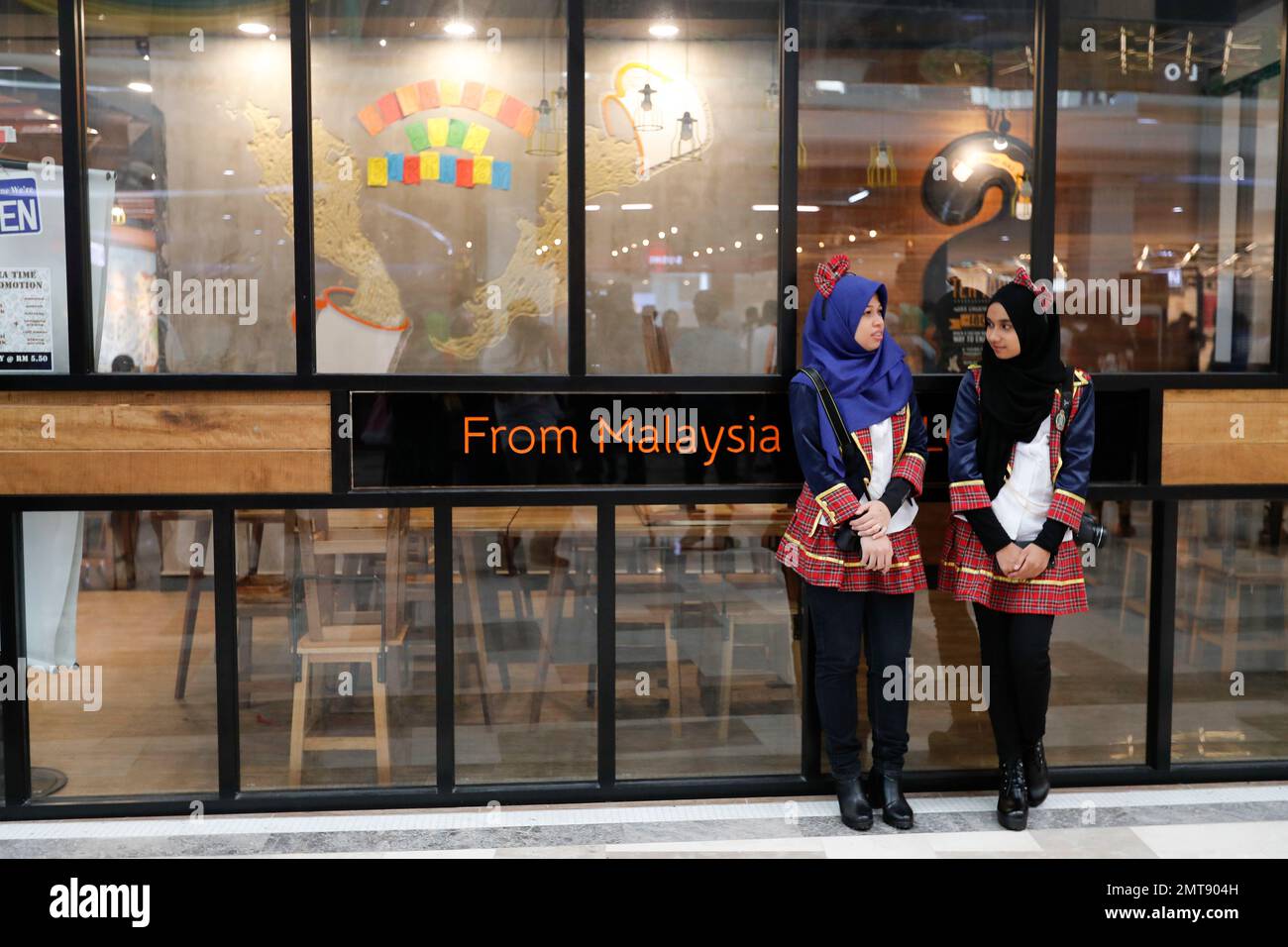 Participants wait for the start of a cosplay event at a shopping mall ...
