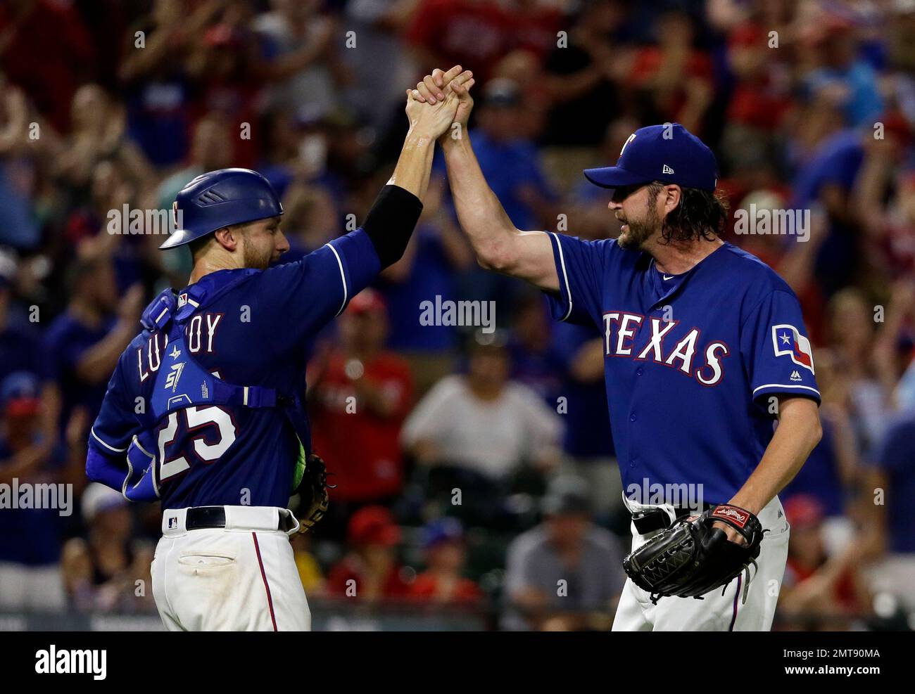 Texas Rangers catcher Jonathan Lucroy (25) and relief pitcher Jason ...