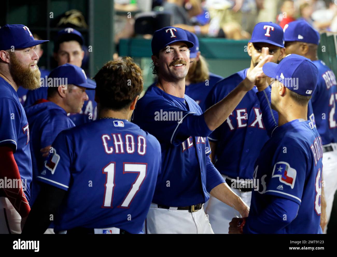 Texas Rangers' Andrew Cashner, left, Shin-Soo Choo (17), of South Korea ...