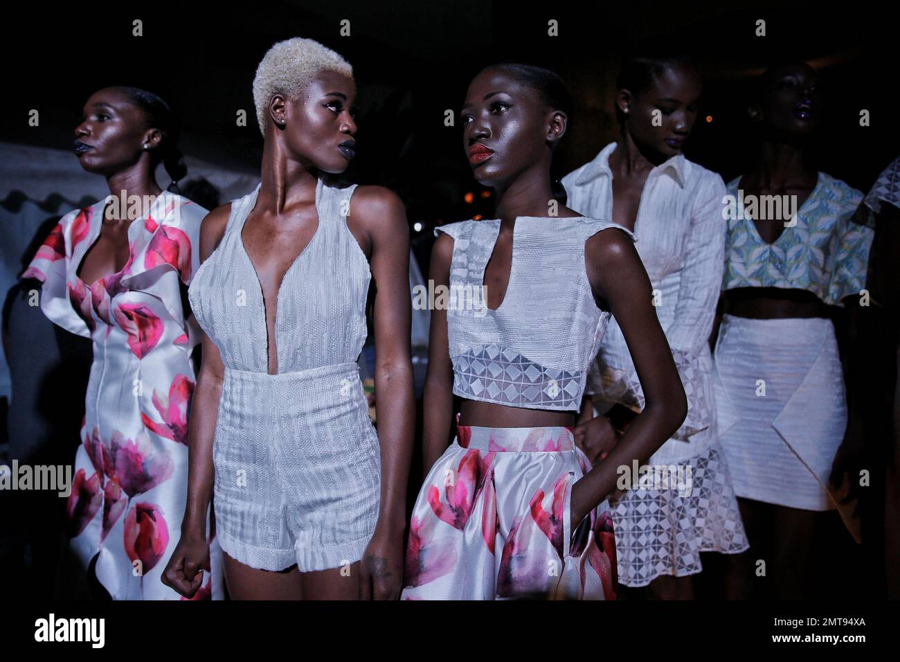 Models sit backstage during Dakar Fashion Week in the Senegalese ...