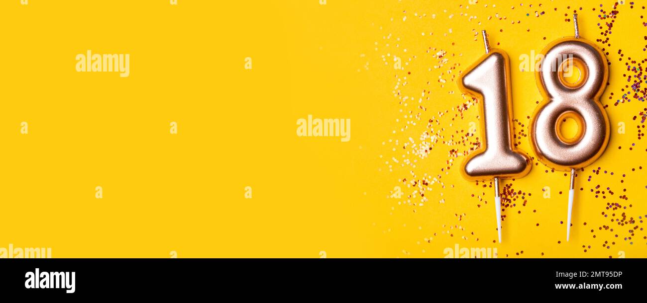 Gold candles in the form of number eighteen Stock Photo - Alamy