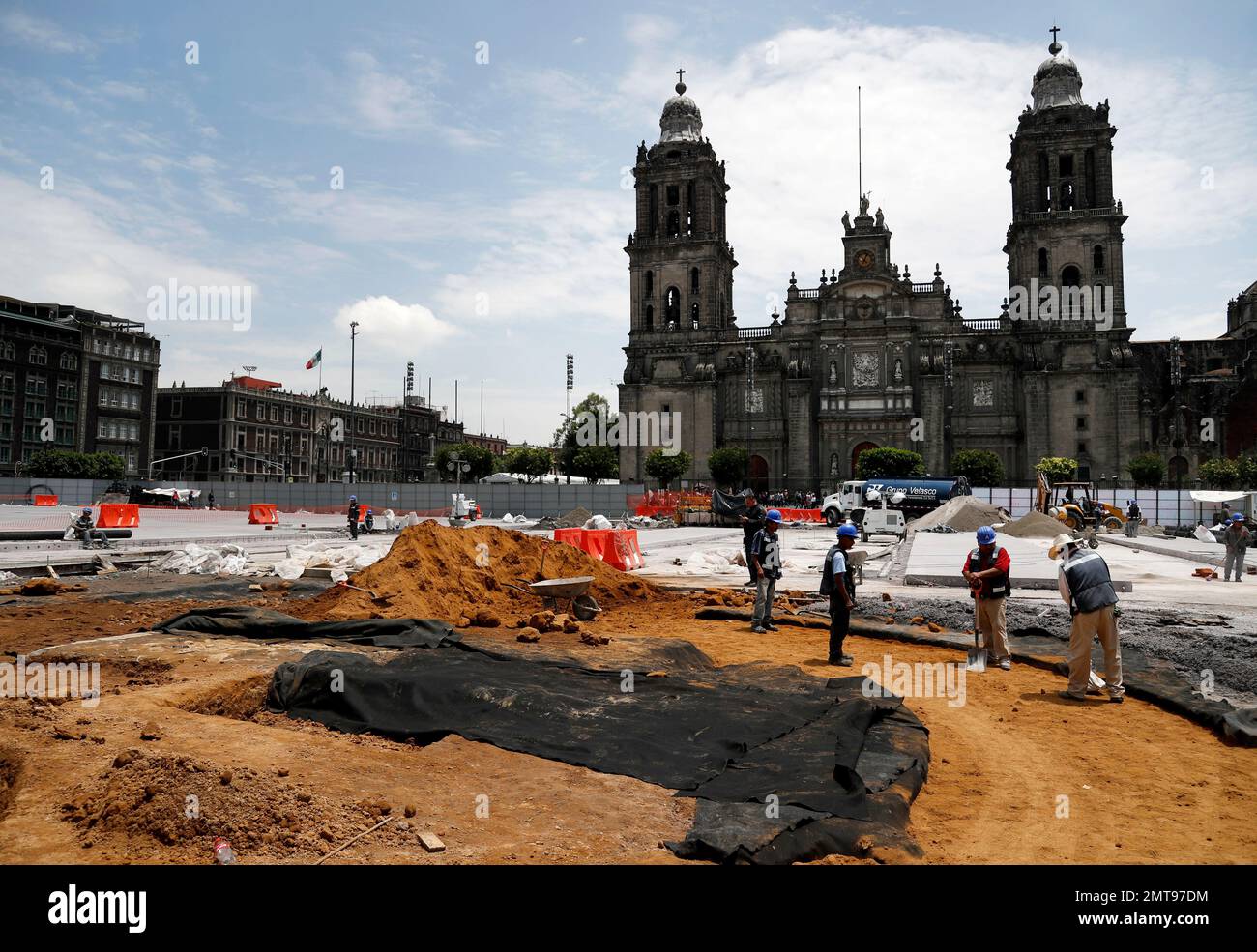 Workers stand by a circular base, or "zocalo," built originally in 1843 ...