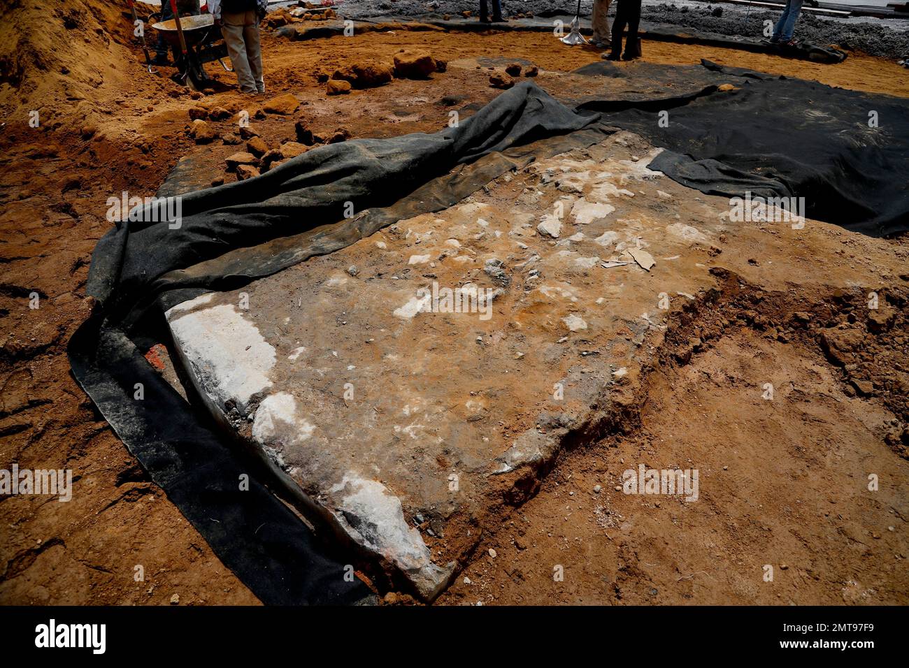 Workers stand by a circular base, or "zocalo," built originally in 1843 ...