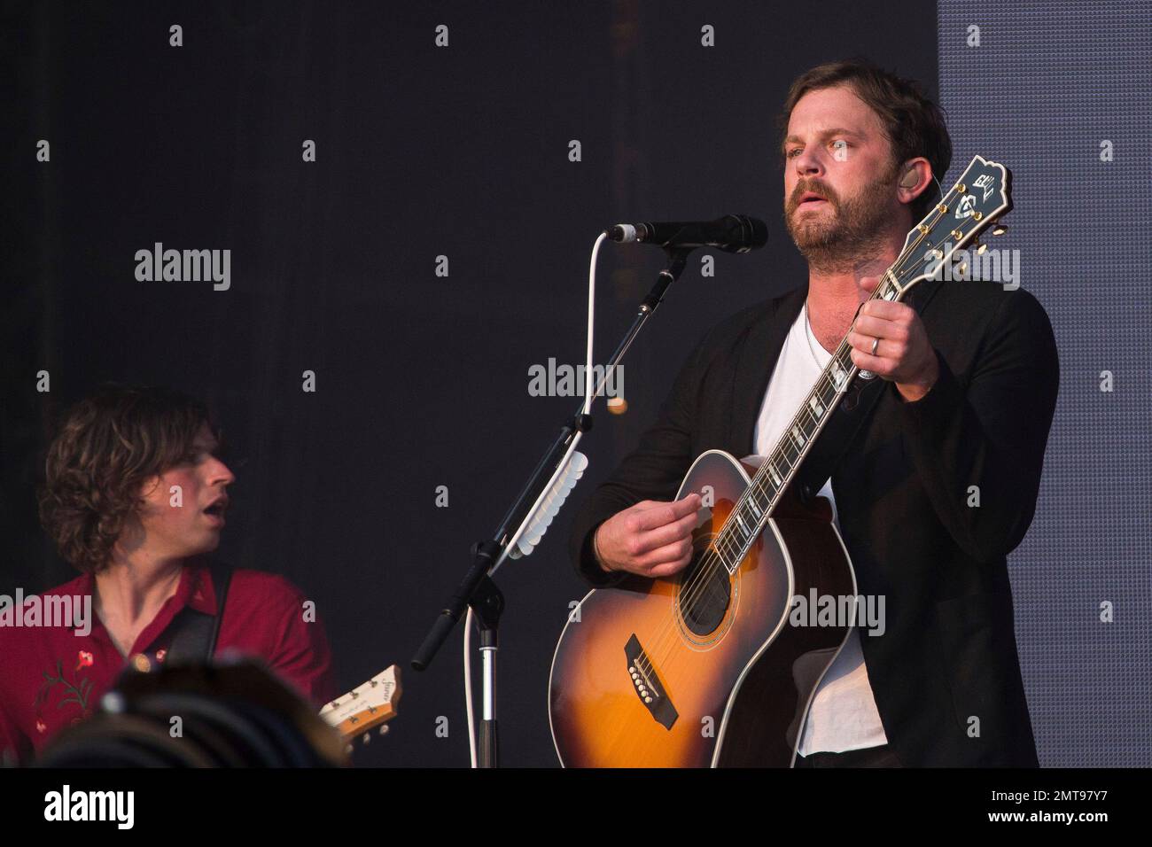 Caleb Followill, right, lead singer of Kings of Leon performs on stage ...