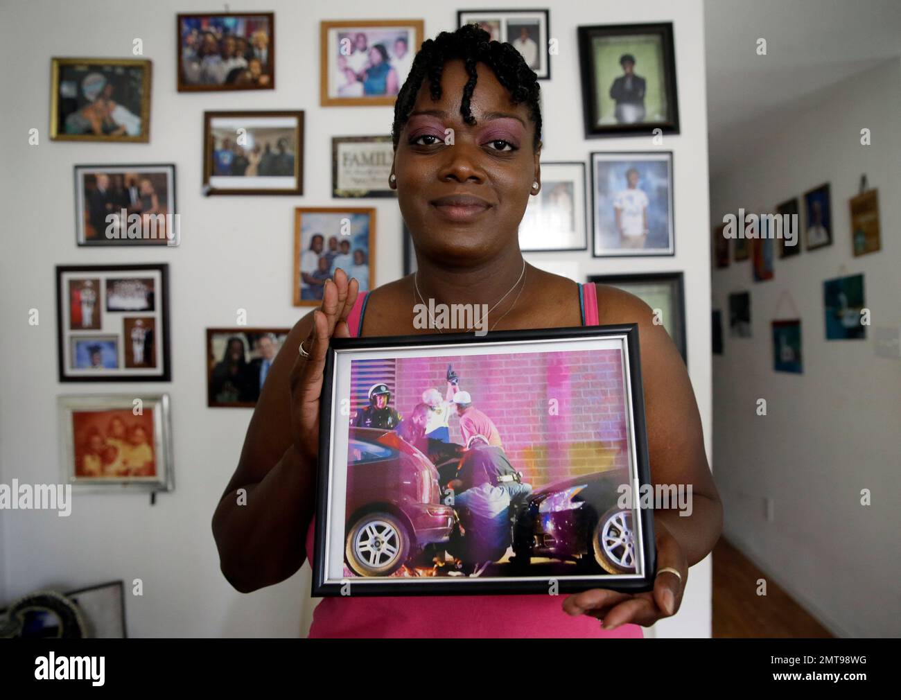 In this June 30, 2017, photo, Shetamia Taylor holds a picture that ...