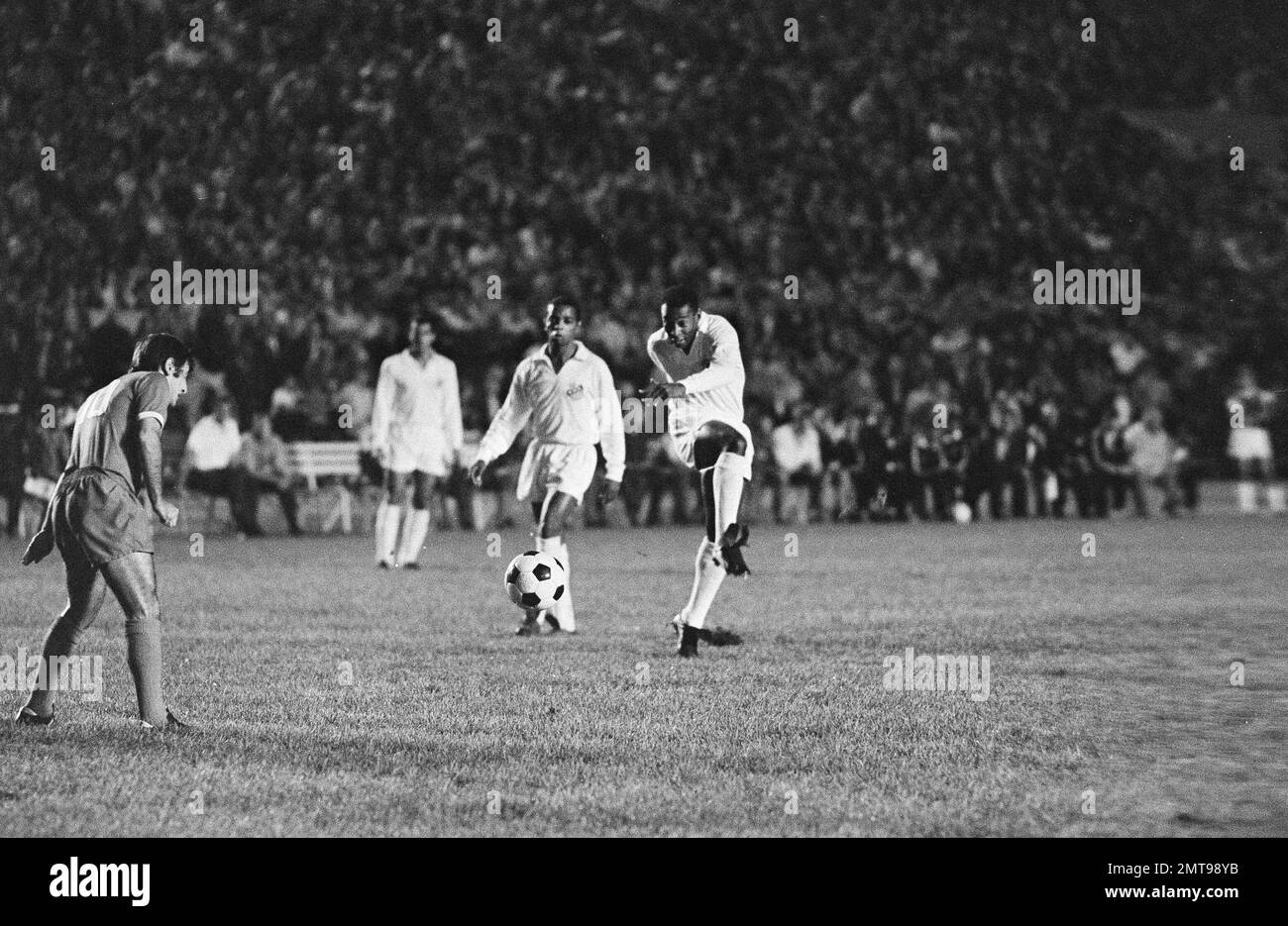 Pele, star of Brazil's Santos soccer team, shots on goal during game ...