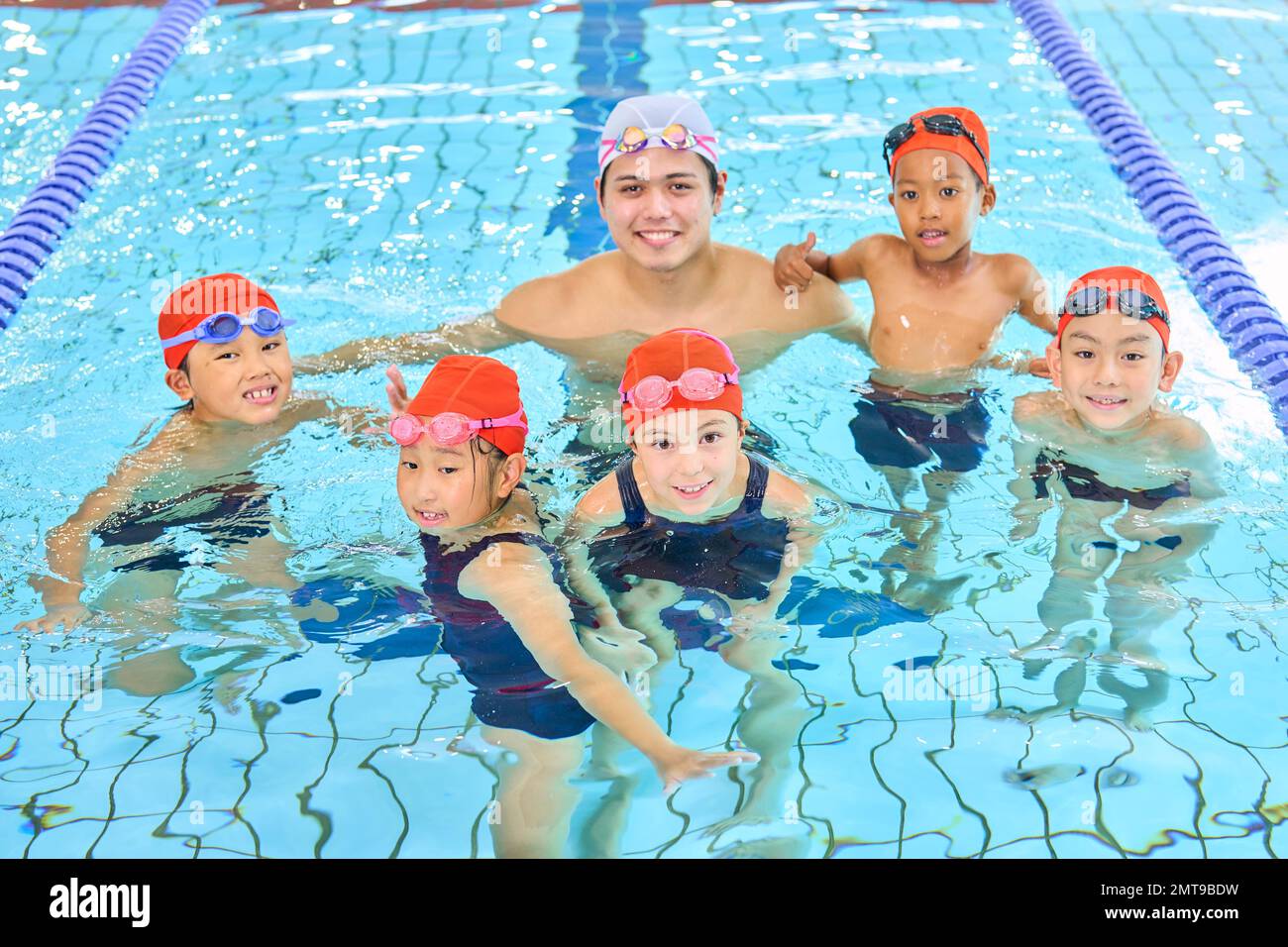 Kids at indoor swimming pool Stock Photo - Alamy