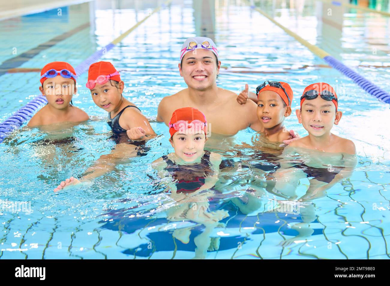 Kids at indoor swimming pool Stock Photo - Alamy