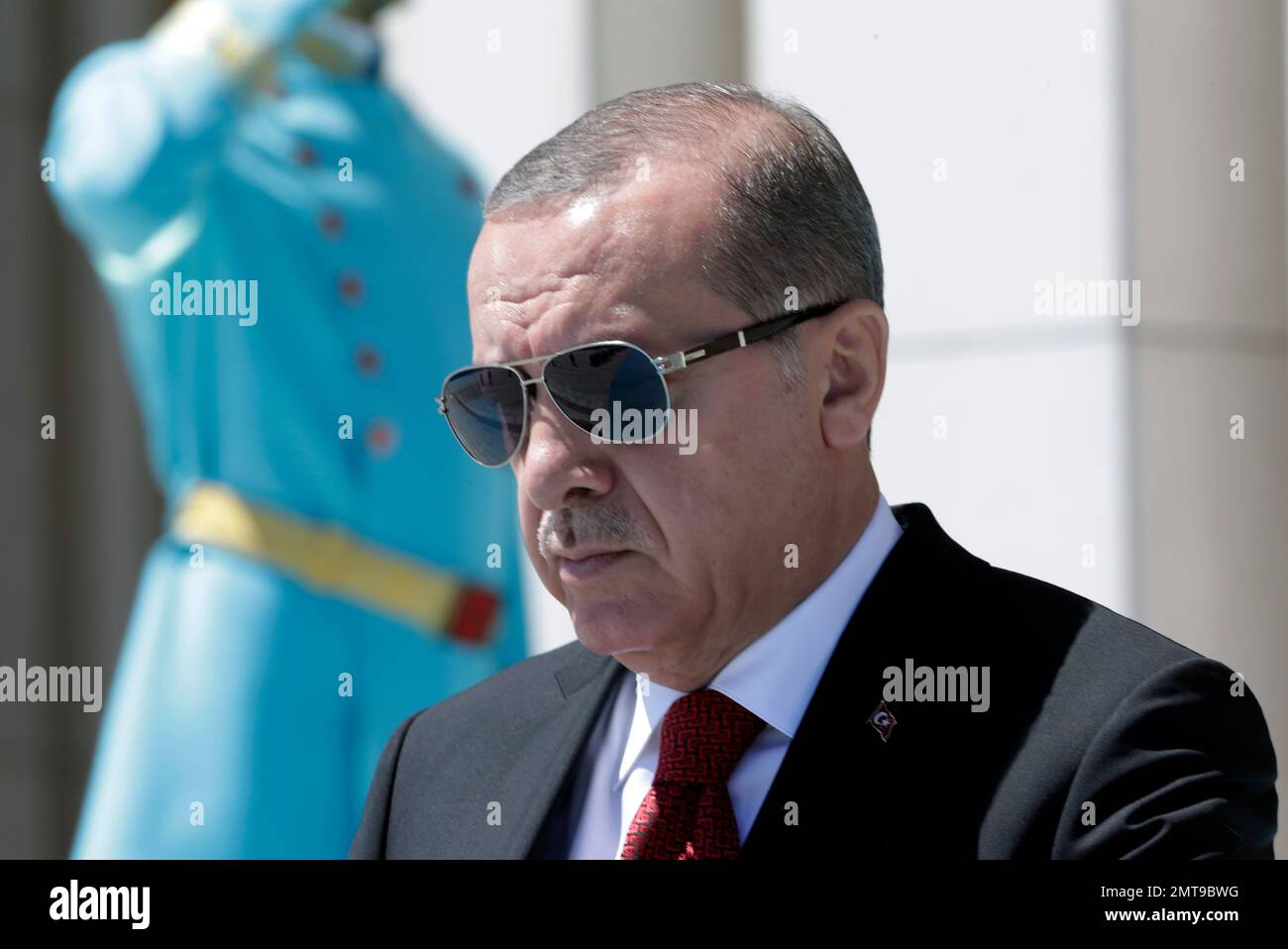 Turkey's President Recep Tayyip Erdogan walks before a welcome ceremony for Indonesian President ...