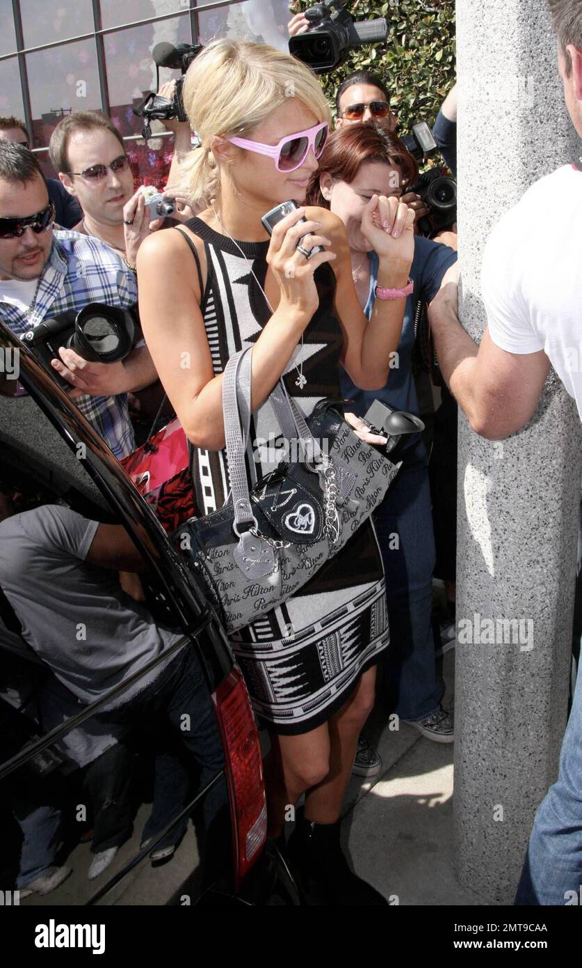 Paris Hilton primps herself during a shopping trip to Diane von ...