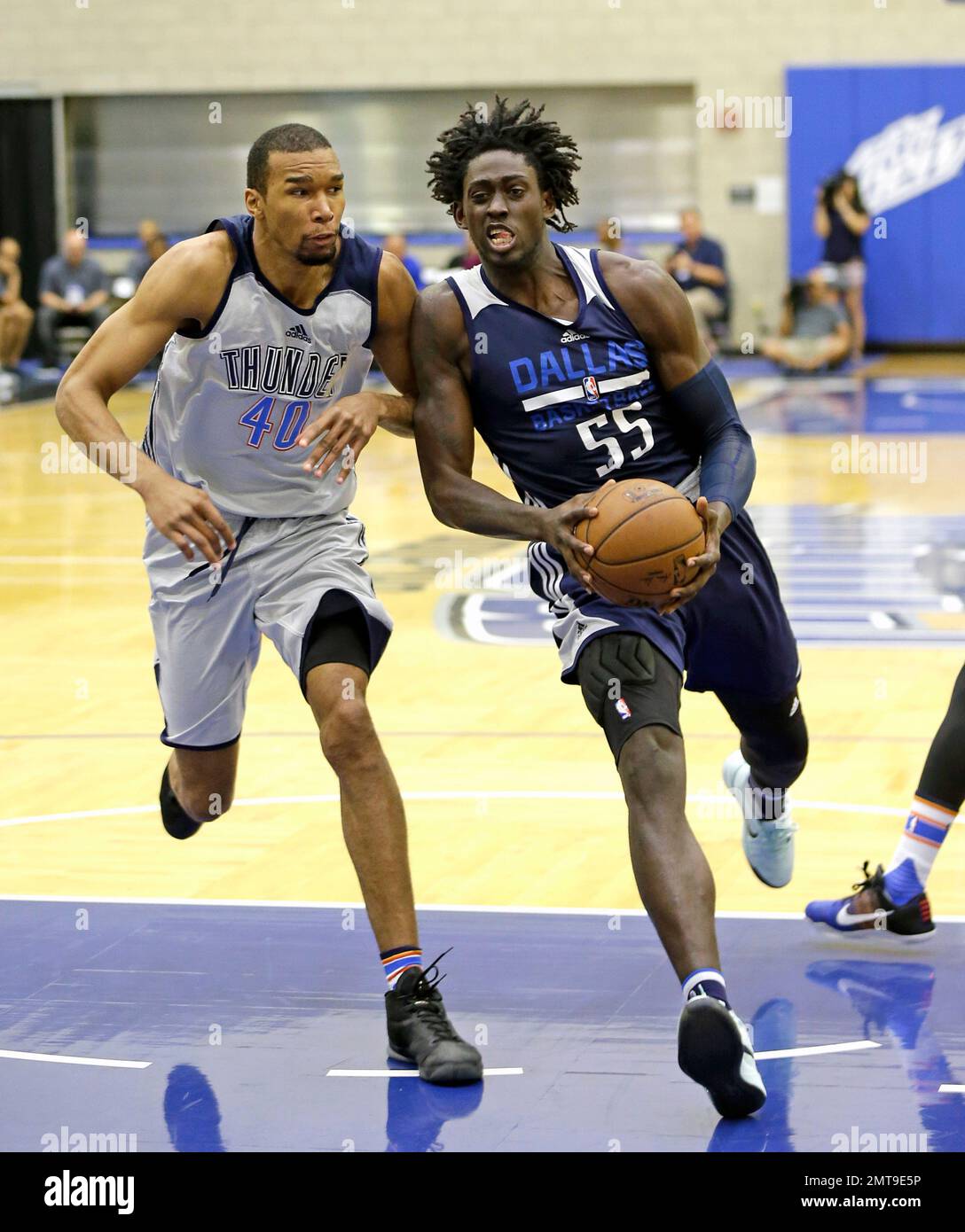 Dallas Mavericks' Johnathan Motley (55) moves to the basket past ...