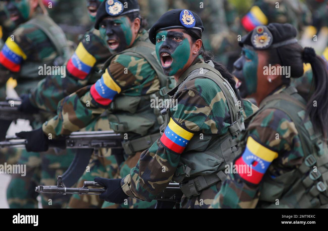 Female soldiers march during a military parade marking the country's ...