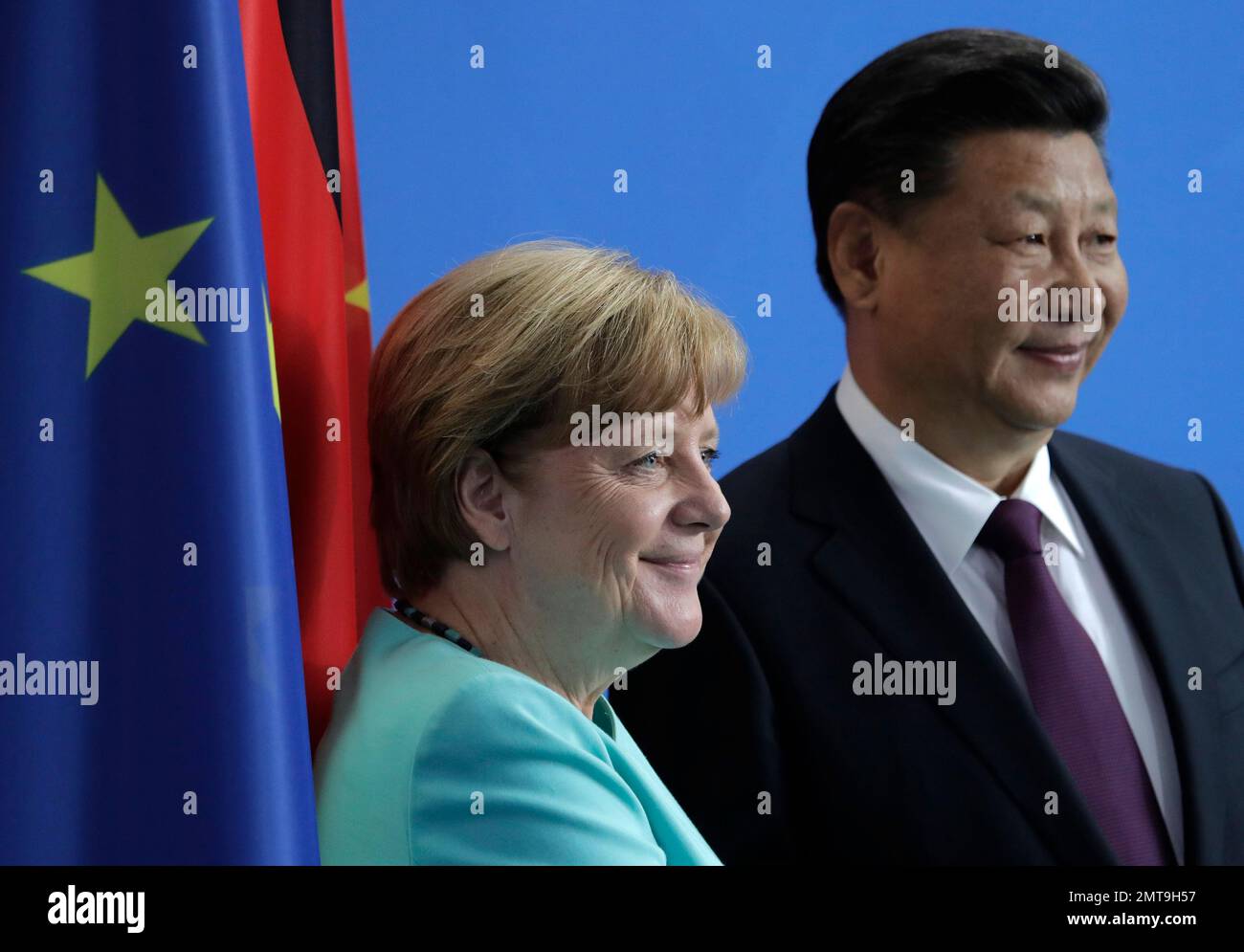 German Chancellor Angela Merkel, left, and Chinese President Xi Jinping ...