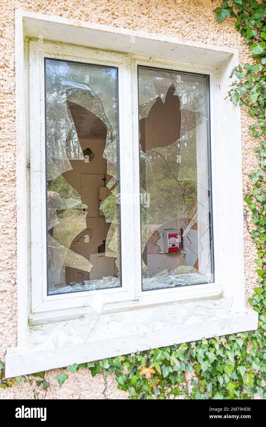 Interior of abandoned Hospital viewed through smashed window hand ...