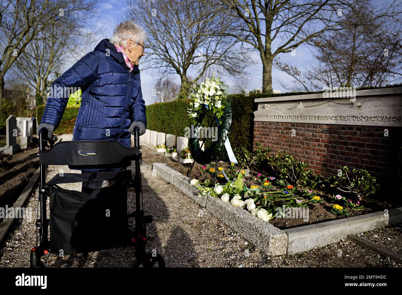 ZUIDLAND - A woman walks past the wreath at the monument to the victims ...