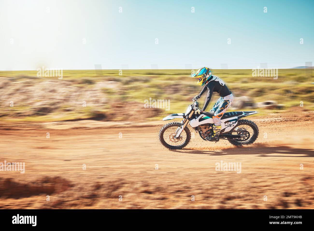 Motorbike, motorcross and speed on sand trail with power, sunshine and ...