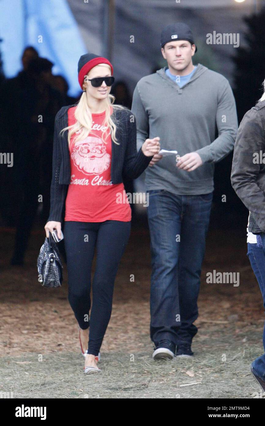 Paris Hilton looks like one of Santa's little helpers wearing an 'I ...