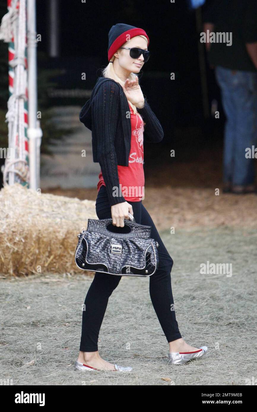 Paris Hilton looks like one of Santa's little helpers wearing an 'I ...