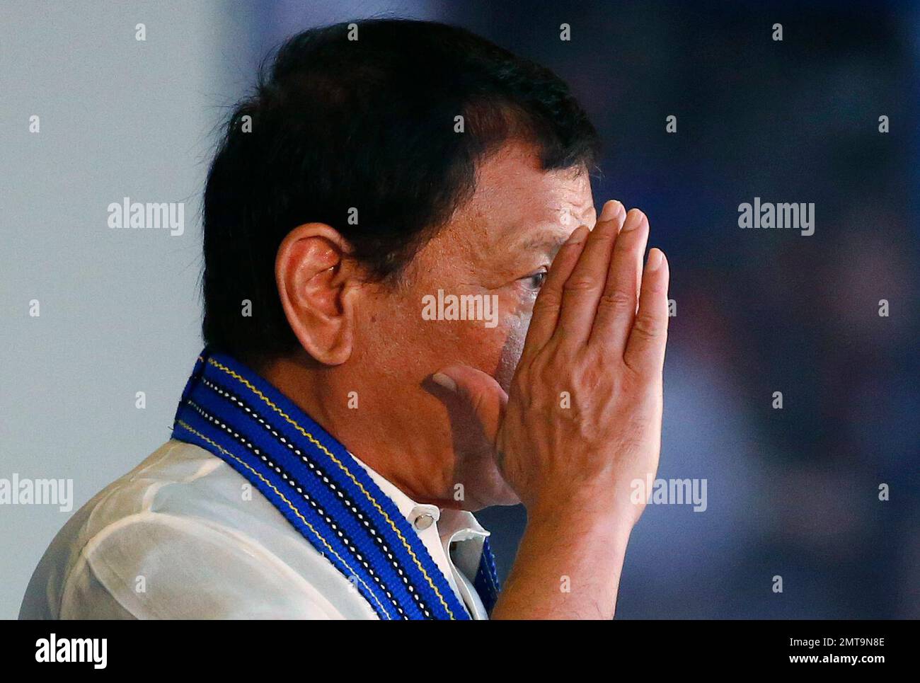 Philippine President Rodrigo Duterte salutes the troops during the 70th ...