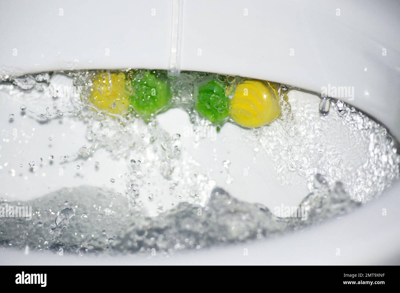 A closeup of a fragrance stone in the toilet flush toilet Stock Photo ...