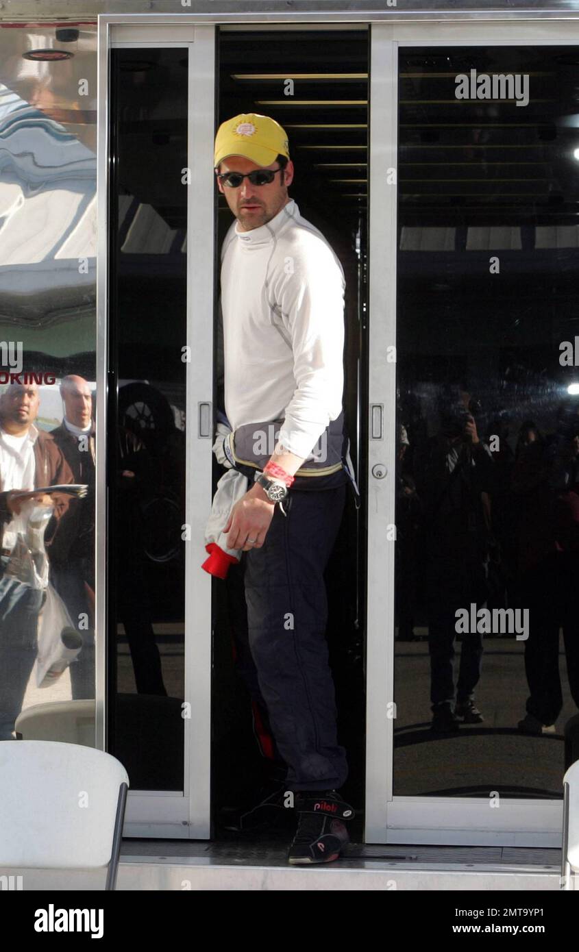 Actor Patrick Dempsey walks out of his trailer after his qualifying run ...