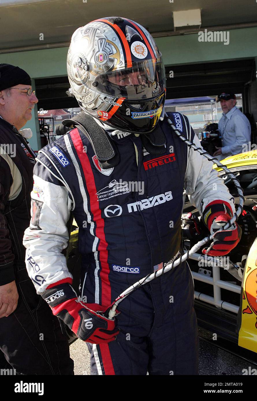 Actor Patrick Dempsey walks to his trailer after his qualifying run for ...