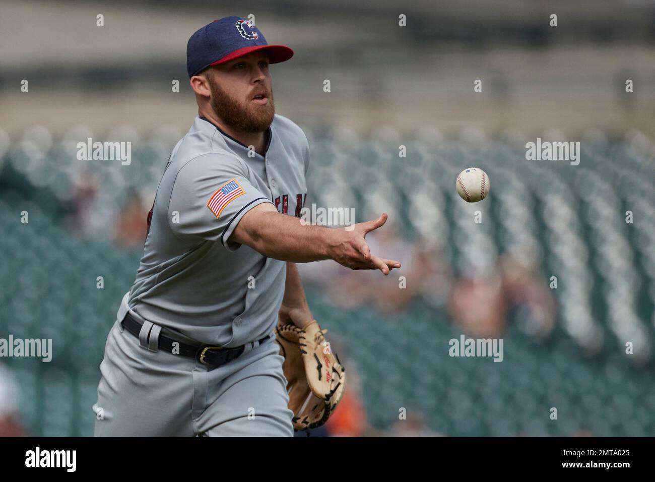 Cleveland Indians relief pitcher Cody Allen underhands the ball to ...