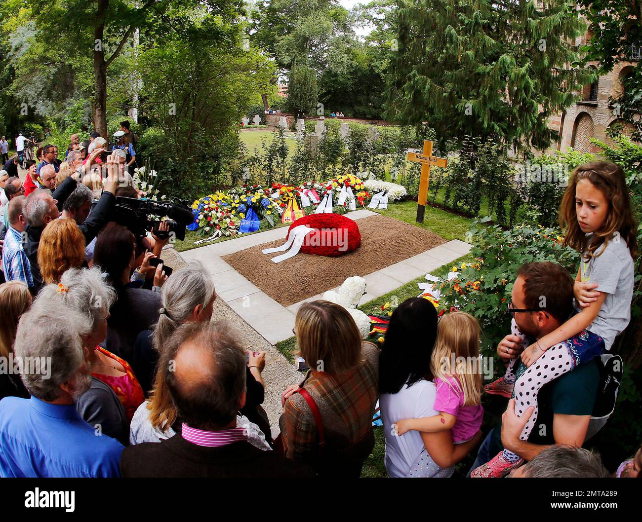 People stand at the grave of late German Chancellor Helmut Kohl at the ...