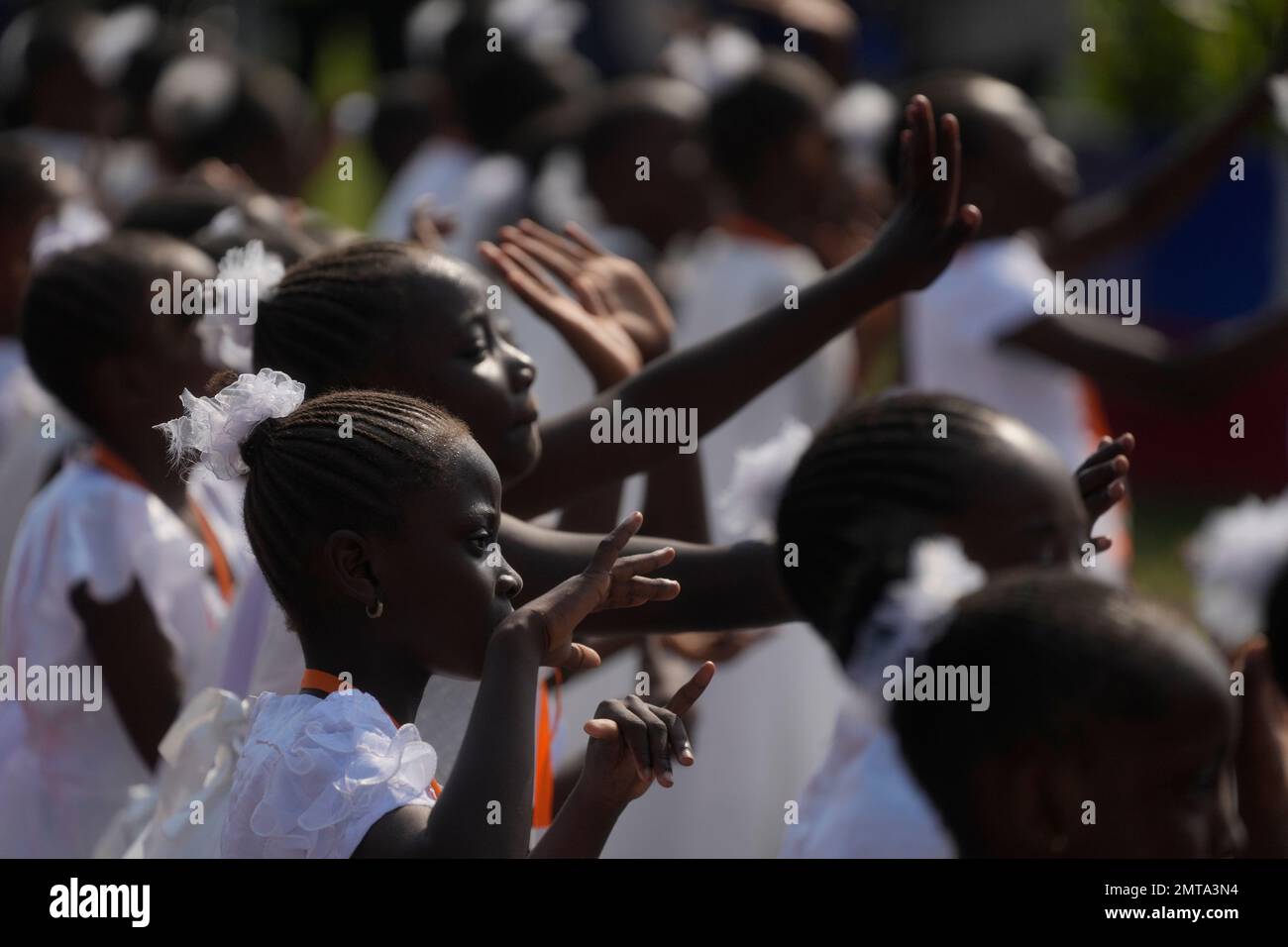 Children chant and dance as they with for PopeFrancis at Ndolo airport ...