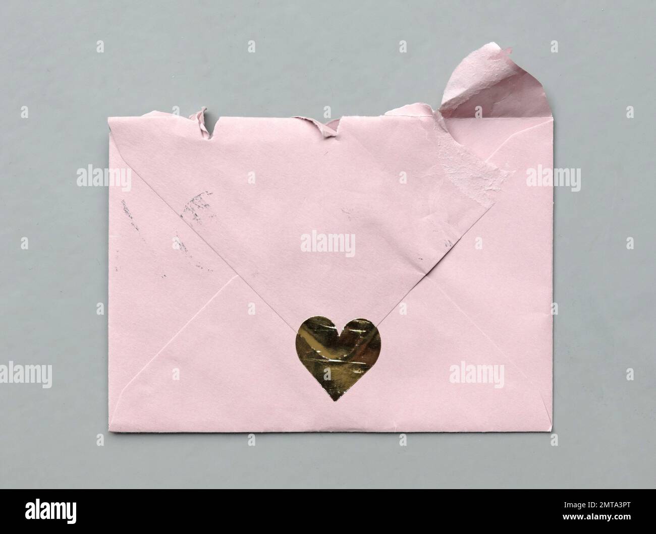 Torn (opened) envelope on a grey background Stock Photo - Alamy