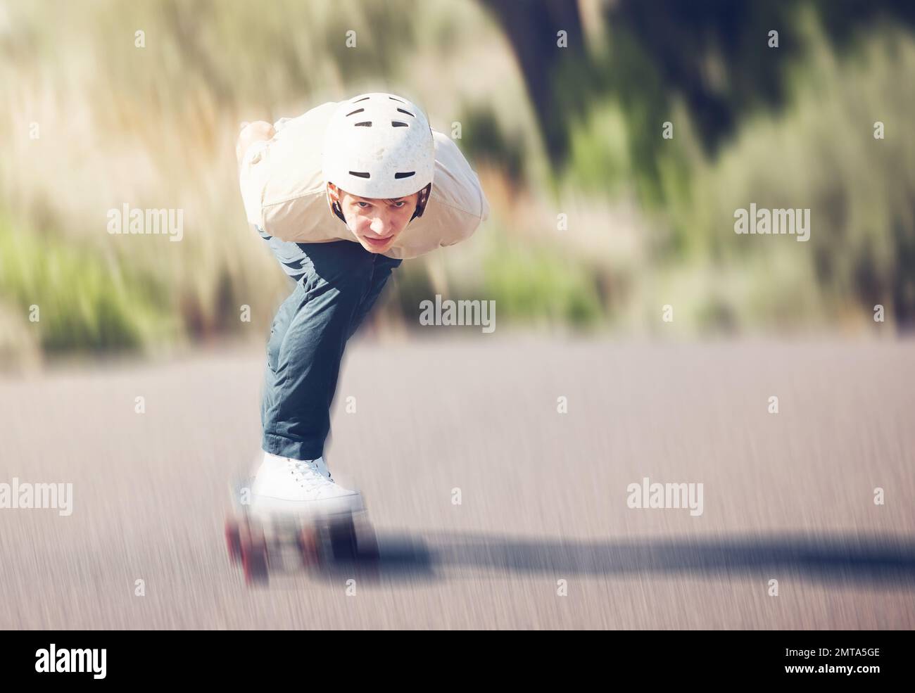 Motion blur, skateboard and mock up with a man athlete training outdoor ...