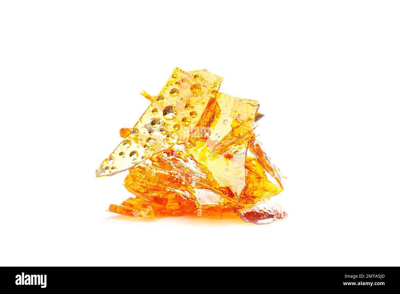 yellow wax piece with high THC isolated on white background Stock Photo ...