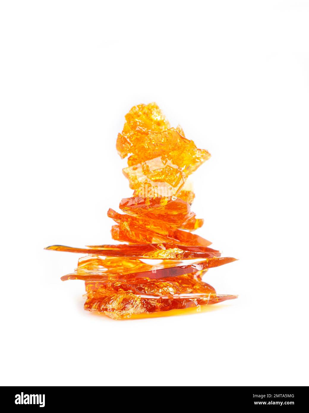 a pieces of cannabis wax closeup. concentrate dab stone with high thc ...