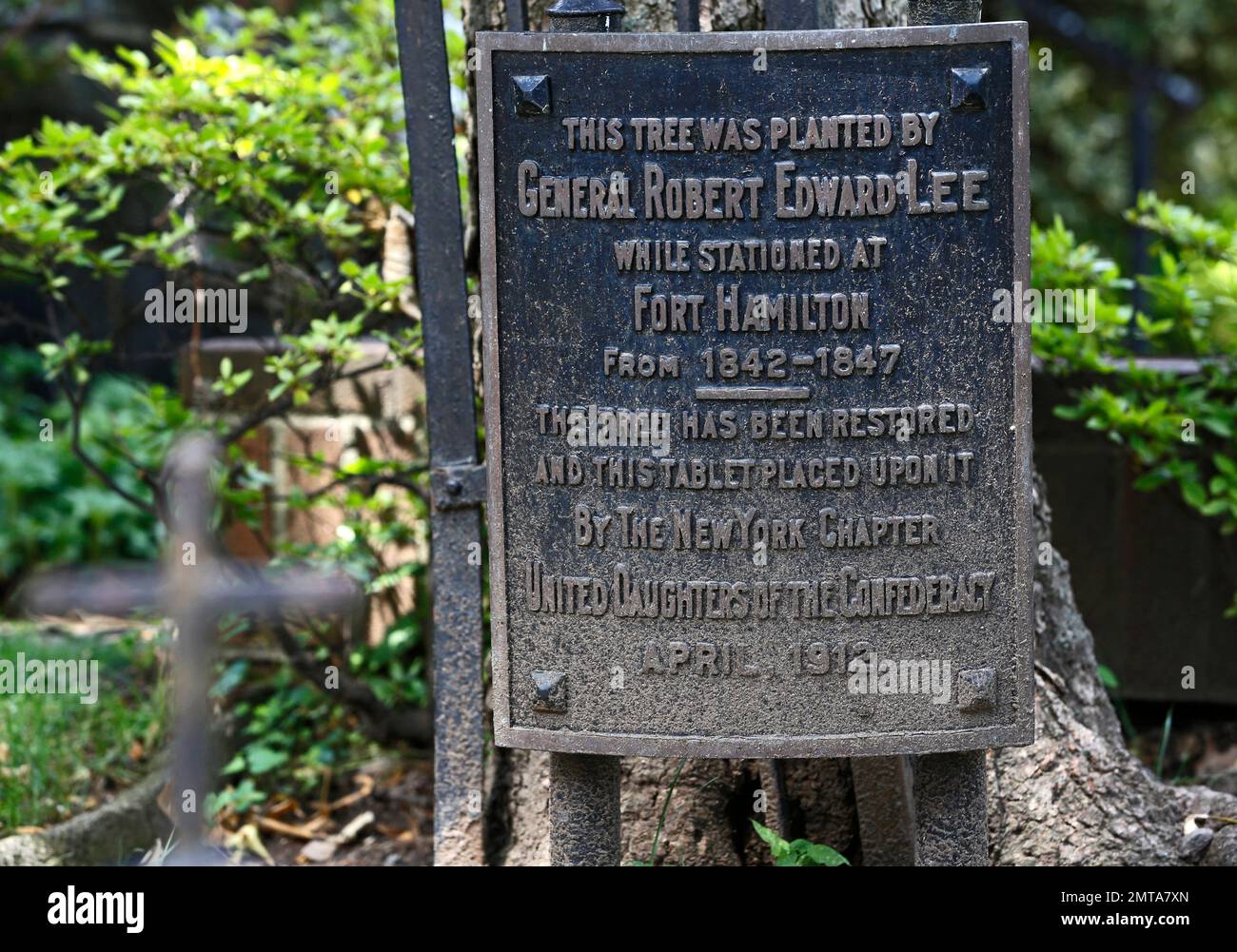 In this June 27, 2017 photo, a plaque marks a maple tree planted by ...